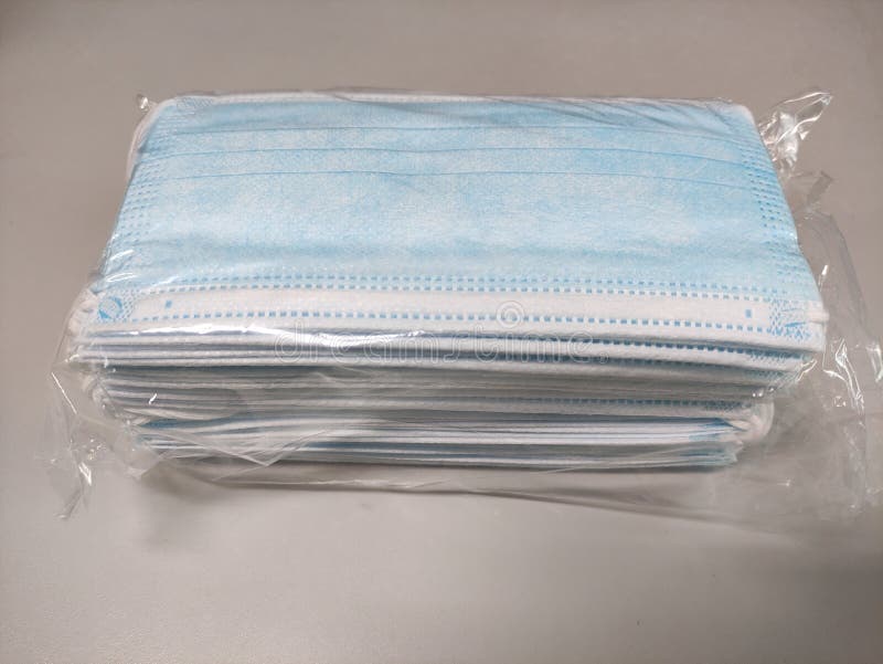 Pile of Masks Wrapped in Plastic Stock Image - Image of flooring ...