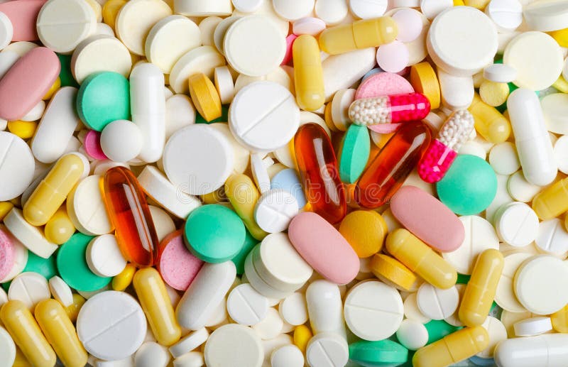 Pile of Multi-colored Tablets and Capsules. Variable Medical Concept ...