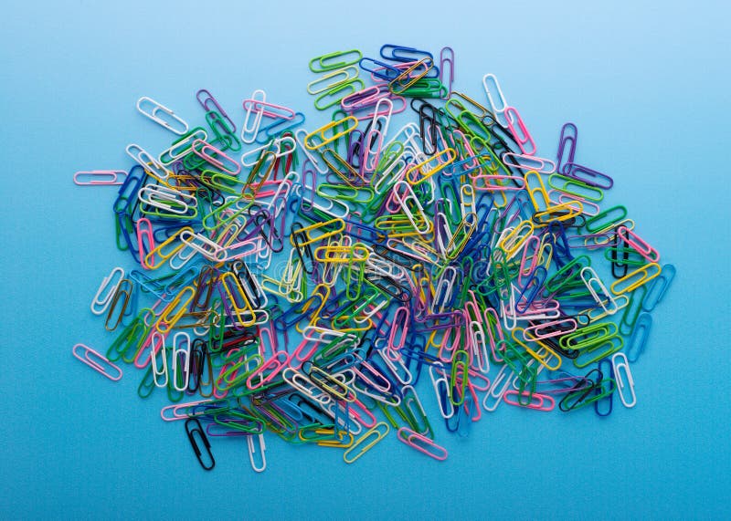 Pile of Multi Coloured Paperclips on Blue Background Stock Image ...