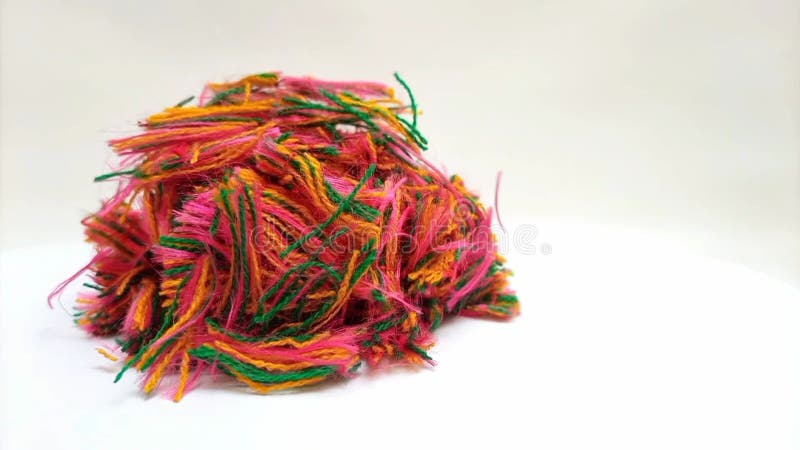 A Pile of Multicolored Thread Strands Rotating on White Background on ...