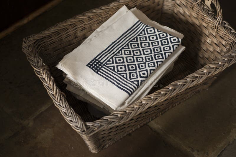 Pile of Napkins with Black Square Pattern in Woven Basket Stock Image ...