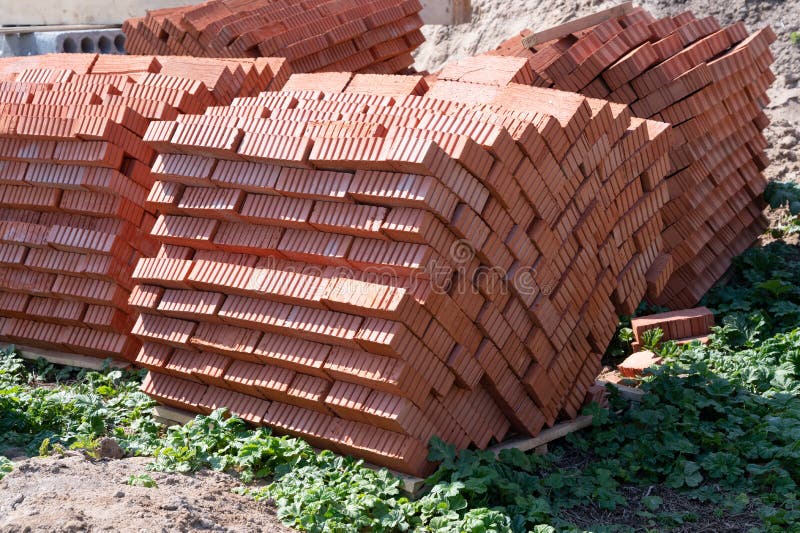 Pile of New Red Bricks on the Ground Stock Photo - Image of estate ...