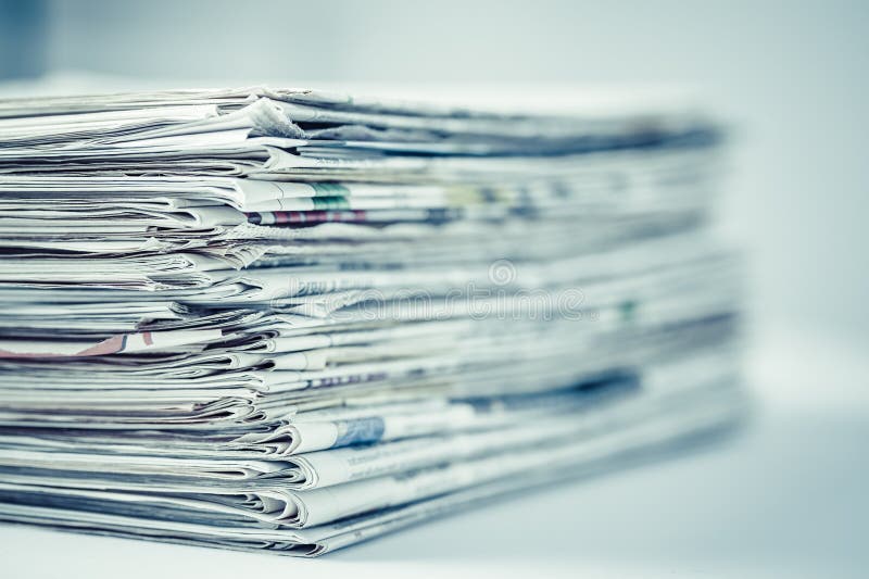 Pile of Newspapers on Table. Folded and Stacked Journals Stock Image ...
