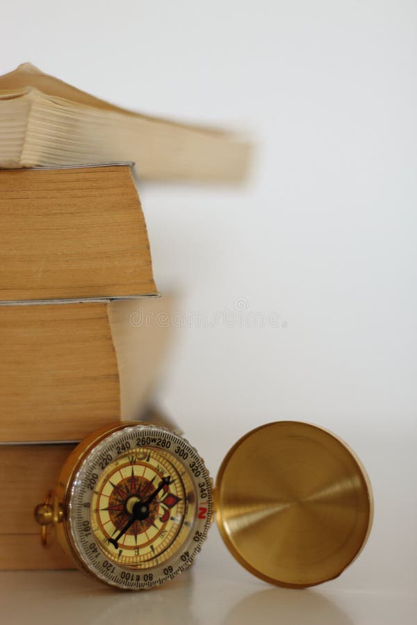 Stack of Books and Compass. Stock Image - Image of intelligence, hand ...