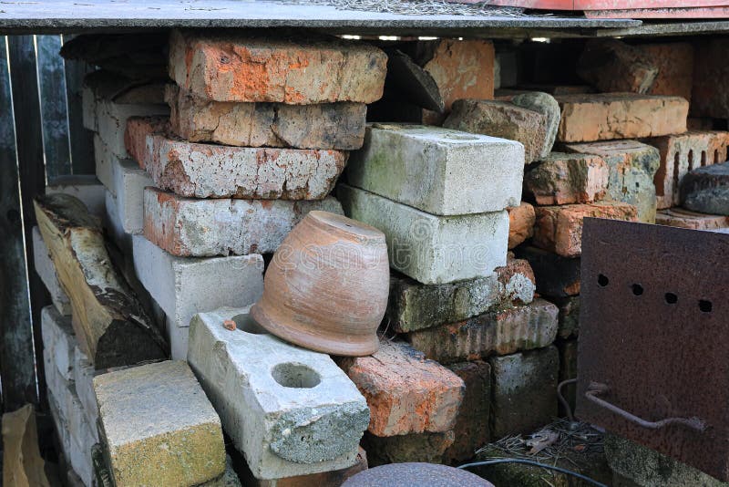 Pile of Old Bricks and an Old Clay Flower Pot Under the Awning Stock ...