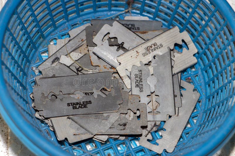 A Pile of Old Razors in a Plastic Basket Stock Photo - Image of ...