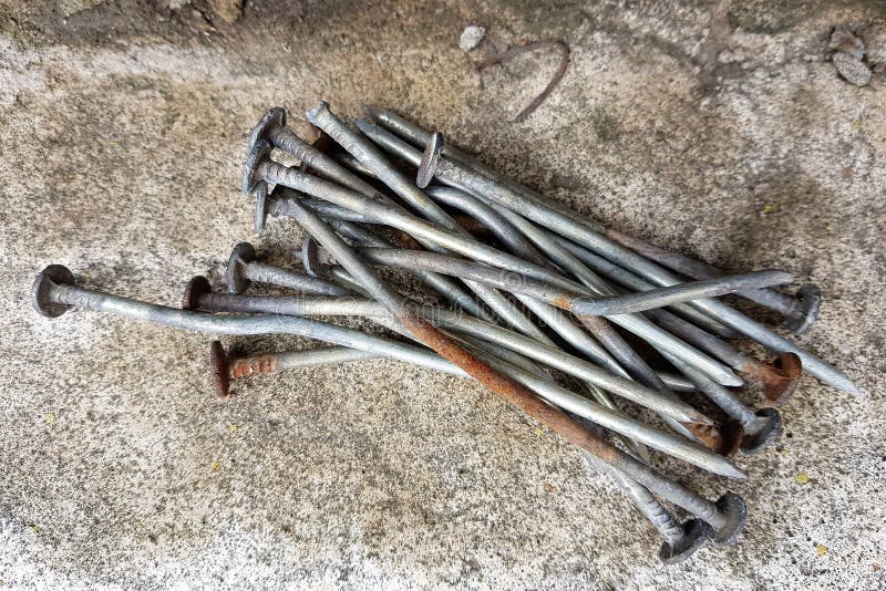 Pile Old Rusty Long Nails on the Surface of the Cement Stock Image ...