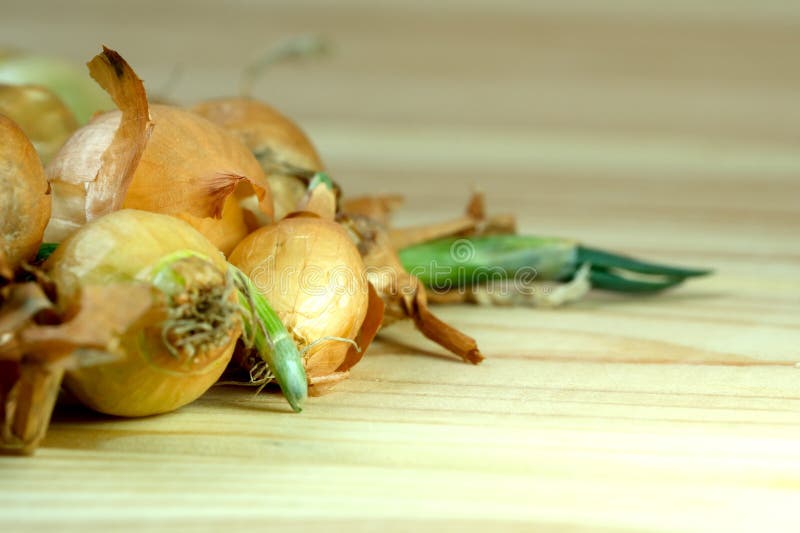 Pile of Onions on Wooden Table Stock Photo - Image of food, pile: 319149048