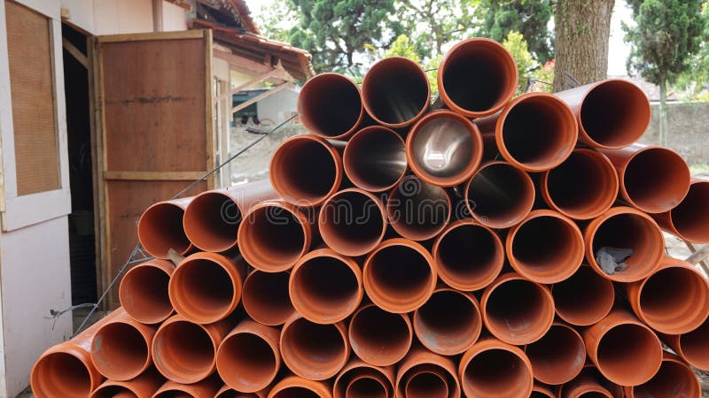 Pile Orange PVC Drainage Pipes in a Sewer Installation Project Stock ...