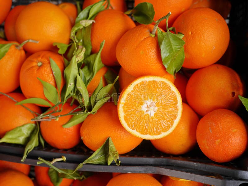 A Pile of Oranges with One Cut Open Stock Photo - Image of plenty ...