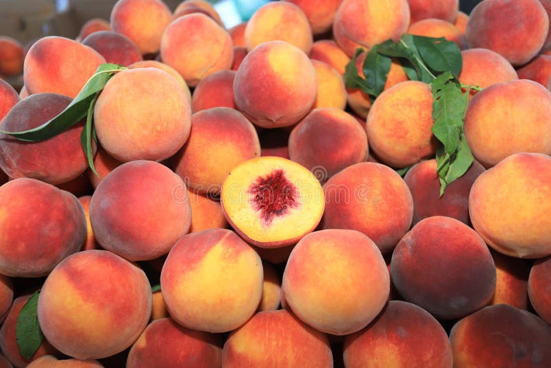 A Pile of Peaches and One Peach, Cut in Half Stock Photo - Image of ...