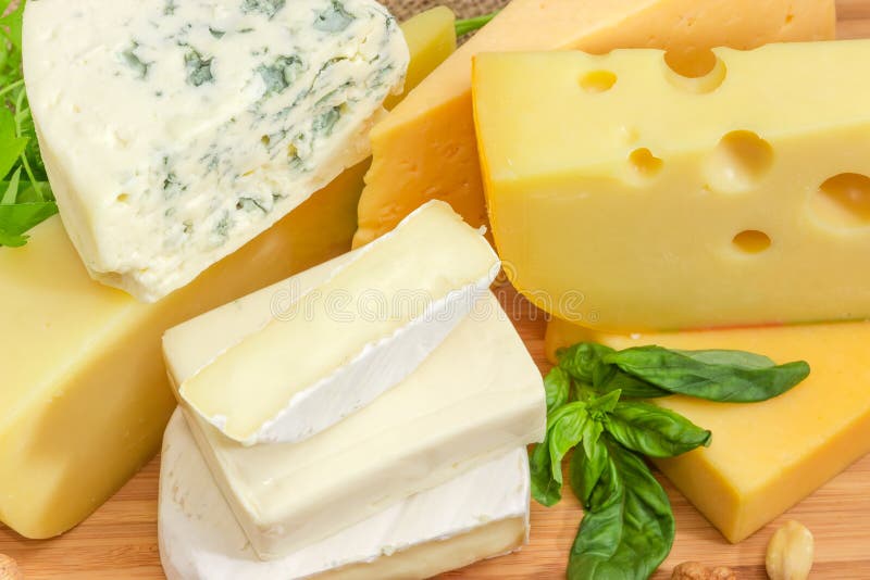 Pile Of Pieces Of Different Cheese Closeup At Selective Focus Stock ...