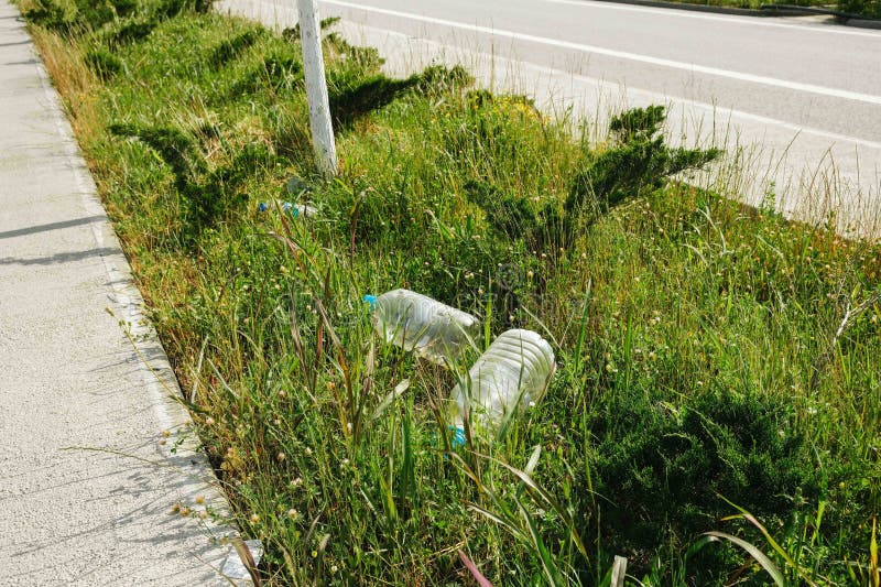 A Pile of Plastic on Green Grass, a Problem in the Natural Environment ...
