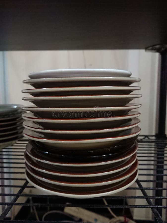 A Pile of Plates in the Cupboard Stock Image - Image of plate, pile ...