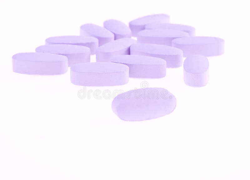 Pile of purple tablets stock image. Image of shapes, medicine - 13444917