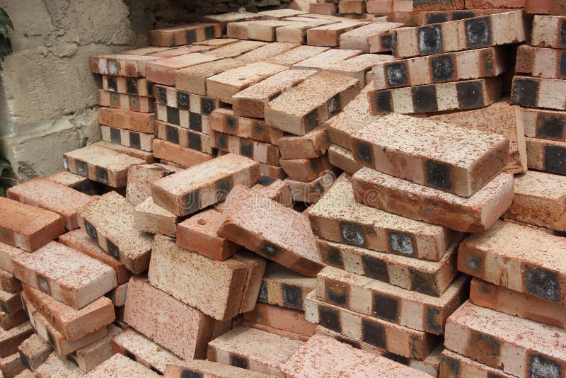 A pile of red bricks stock photo. Image of brown, bricks - 63919794