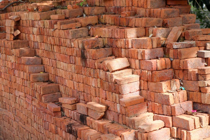 Pile of Red Bricks at Construction Site. Brick Background Stock Photo ...