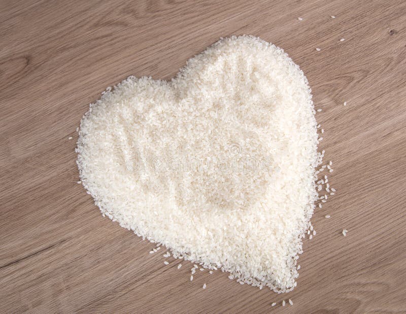 A Pile of Rice in a Heart Shape Stock Image - Image of grain, white ...