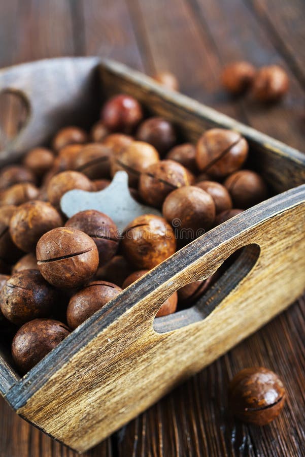 A Pile of Roasted Macadamia Nut on a Table Stock Photo - Image of shell ...