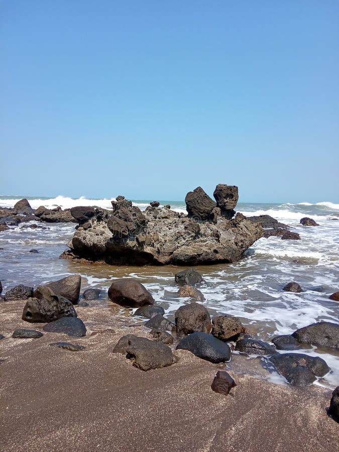 Pile of rocks on the beach stock photo. Image of rock - 221507794