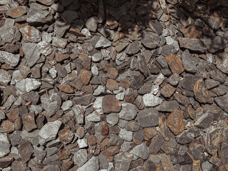 Pile of Rocks with a Shadow Cast on it Stock Image - Image of stones ...