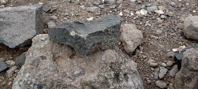 A Pile of Rocks of Various Sizes and Shades of Grey,in the Middle There ...
