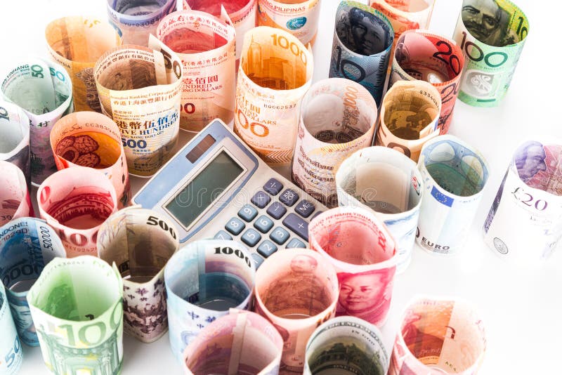 Pile of Rolled-up Currency Notes with a Calculator Stock Image - Image ...