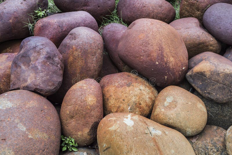 Pile of round rocks stock photo. Image of brown, wallpaper - 110991842