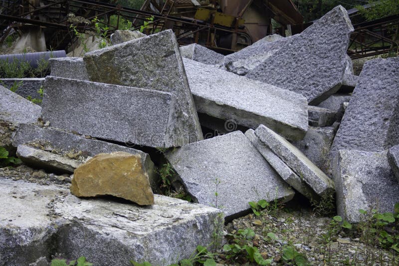 A Pile of Rubble with a Large Rock in the Middle Stock Image - Image of ...