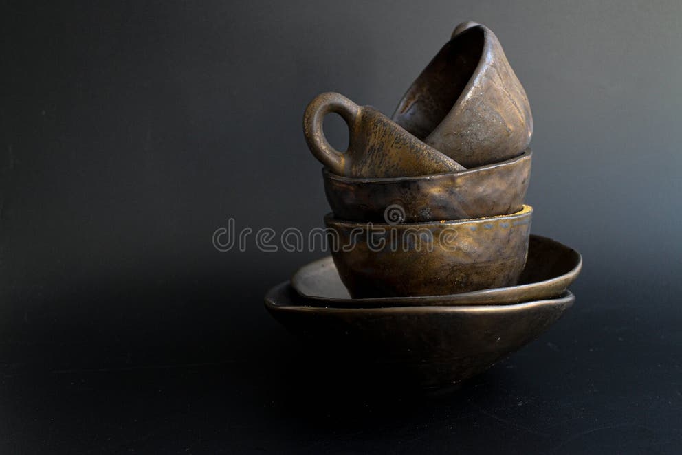 A Pile of Rustic Tea Cup on Black Background Stock Photo - Image of ...