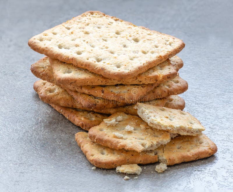 Pile of Salty Cracker Biscuits with a Mixture of Broken and Whole ...