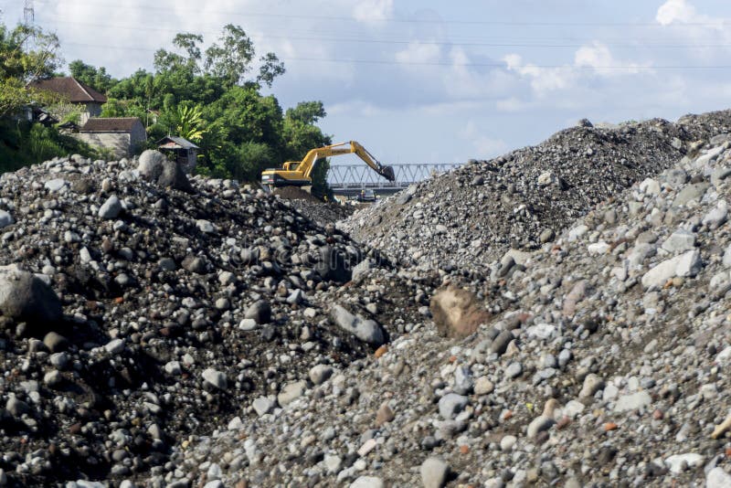 Pile of Sand and Rocks in Construction Area and Excavator Stock Photo ...