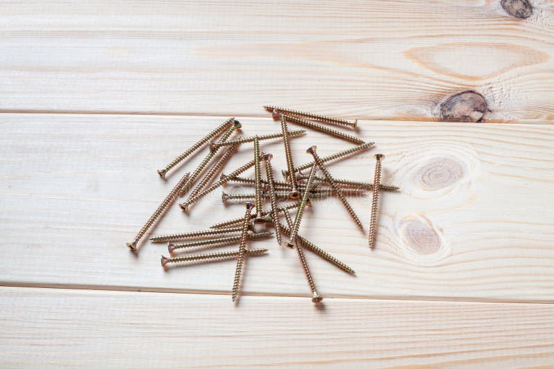 Pile of Screws on a Wooden Table. Self-tapping for Wood. Stock Image ...