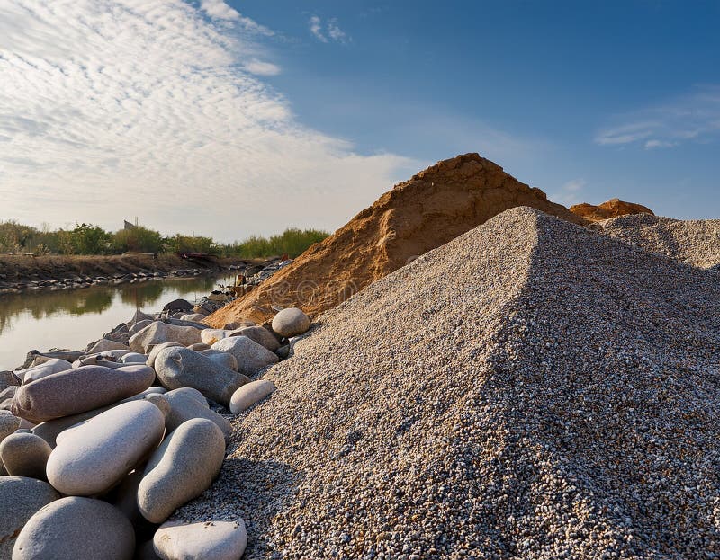 A Pile of Sharp-edged Gravel Contrasting with Smooth River Stones in a ...