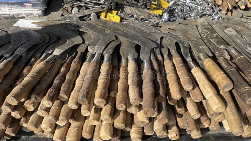 A Pile of Sharp Tools Such As Knives, Machetes, Axes, Sickles, Metal ...