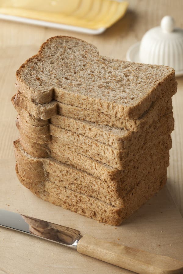 Slices of Brown Bread on a Plate Stock Image - Image of wooden, seed ...