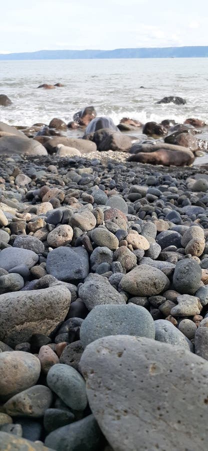 Pile of Small Rocks on the Beach Stock Image - Image of bedrock, coast ...