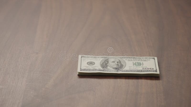 Pile Stack of Hundred Dollar Bills on Walnut Table Slide Shot Stock ...