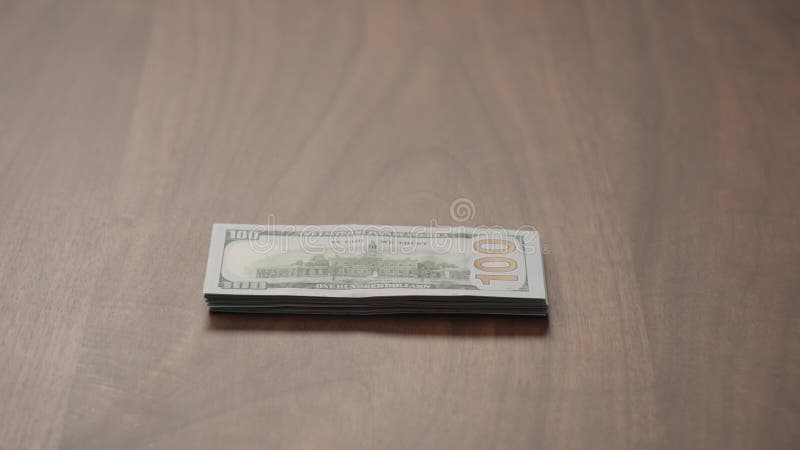 Pile Stack of Hundred Dollar Bills on Walnut Table Slide Shot Stock ...