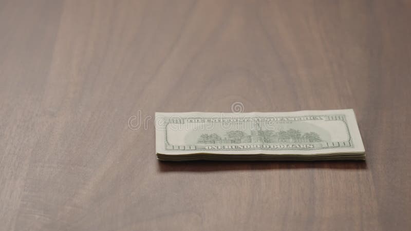 Pile Stack of Hundred Dollar Bills on Walnut Table Slide Shot Stock ...