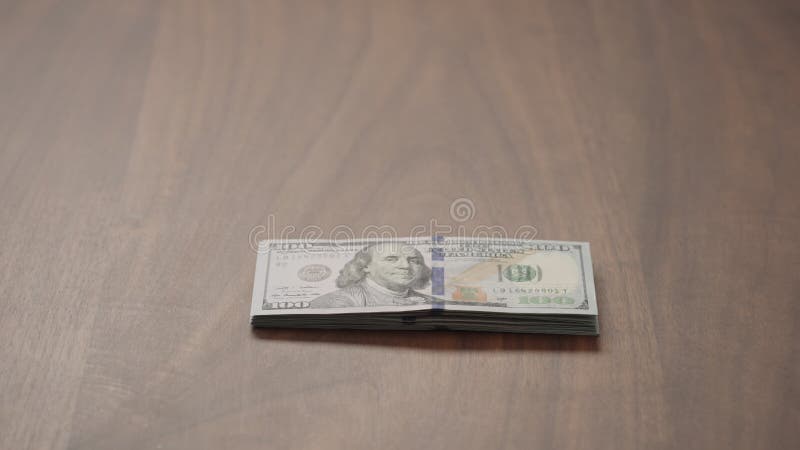 Pile Stack of Hundred Dollar Bills on Walnut Table Slide Shot Stock ...