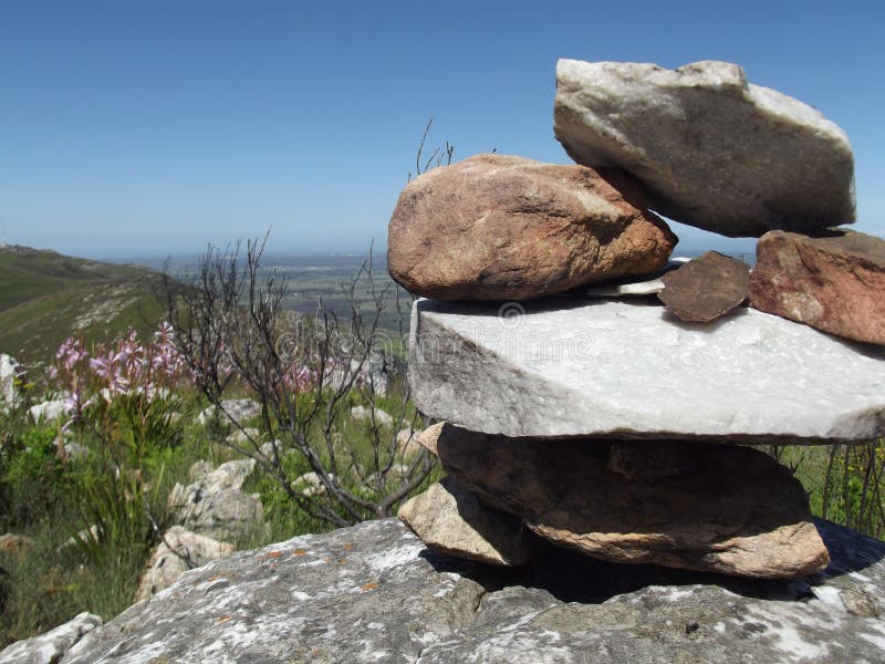 A Pile of Stacked Rocks Overlooking a View from a Mountain Top ...