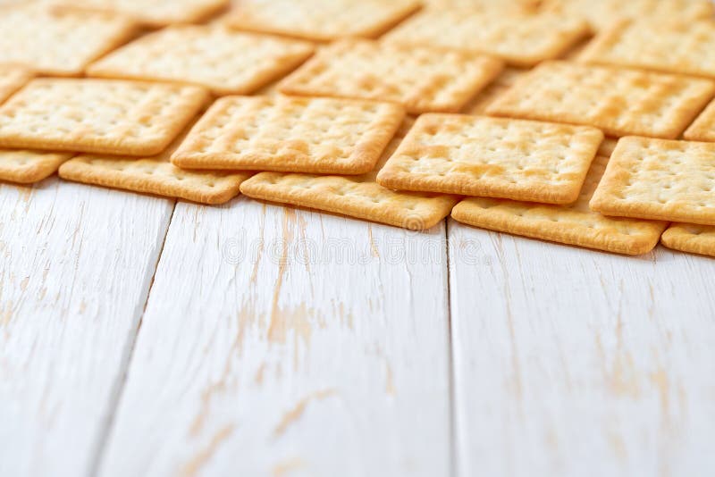 Pile of Tasty Wheat Water Crackers on a Light Kitchen Table, Selective ...