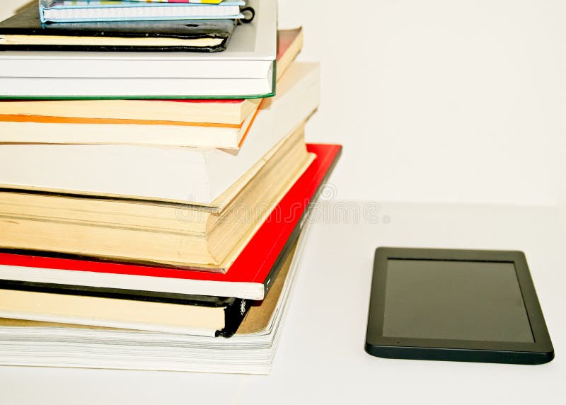 Pile of Text Books and Books Next To an E-book Stock Image - Image of ...