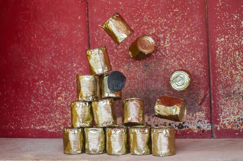 Pile of Tin Cans Falling after Being Hit Stock Photo - Image of ...