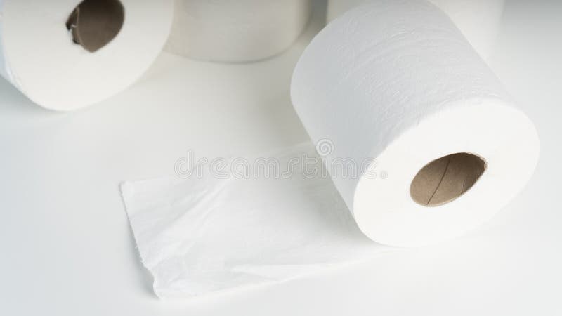 A Pile of Toilet Paper Rolls on a White Table Stock Image - Image of ...