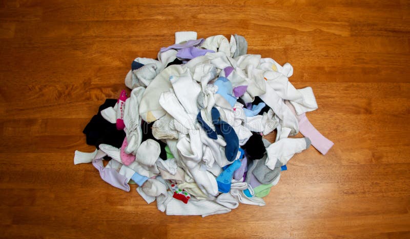Pile of Unsorted Dirty Socks. Messed Up Socks. White Background. Basket ...