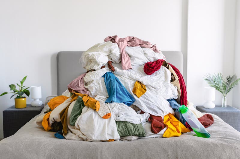 Pile of Unsorted Laundry on a Bed Stock Photo - Image of machine ...