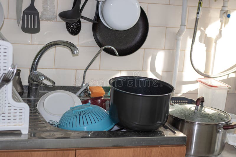 Pile of Unwashed, Dirty Dishes in the Sink. Mess in the Kitchen Stock ...
