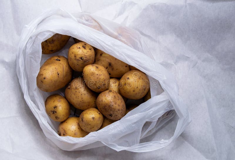 A Pile of Unwashed Potatoes Lies in a Bag Stock Photo - Image of potato ...